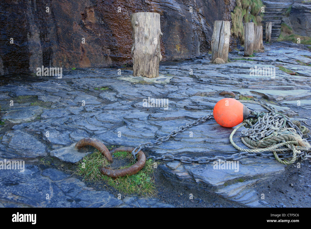 A row of bollards on the quayside around the harbour in the fishing ...