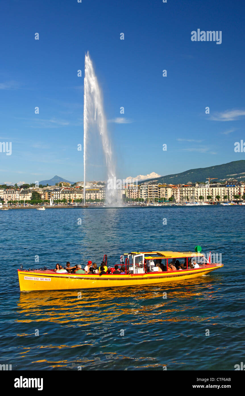 Ferry boat on Lake Geneva, fountain Jet d'Eau and Mont Blanc behind ...