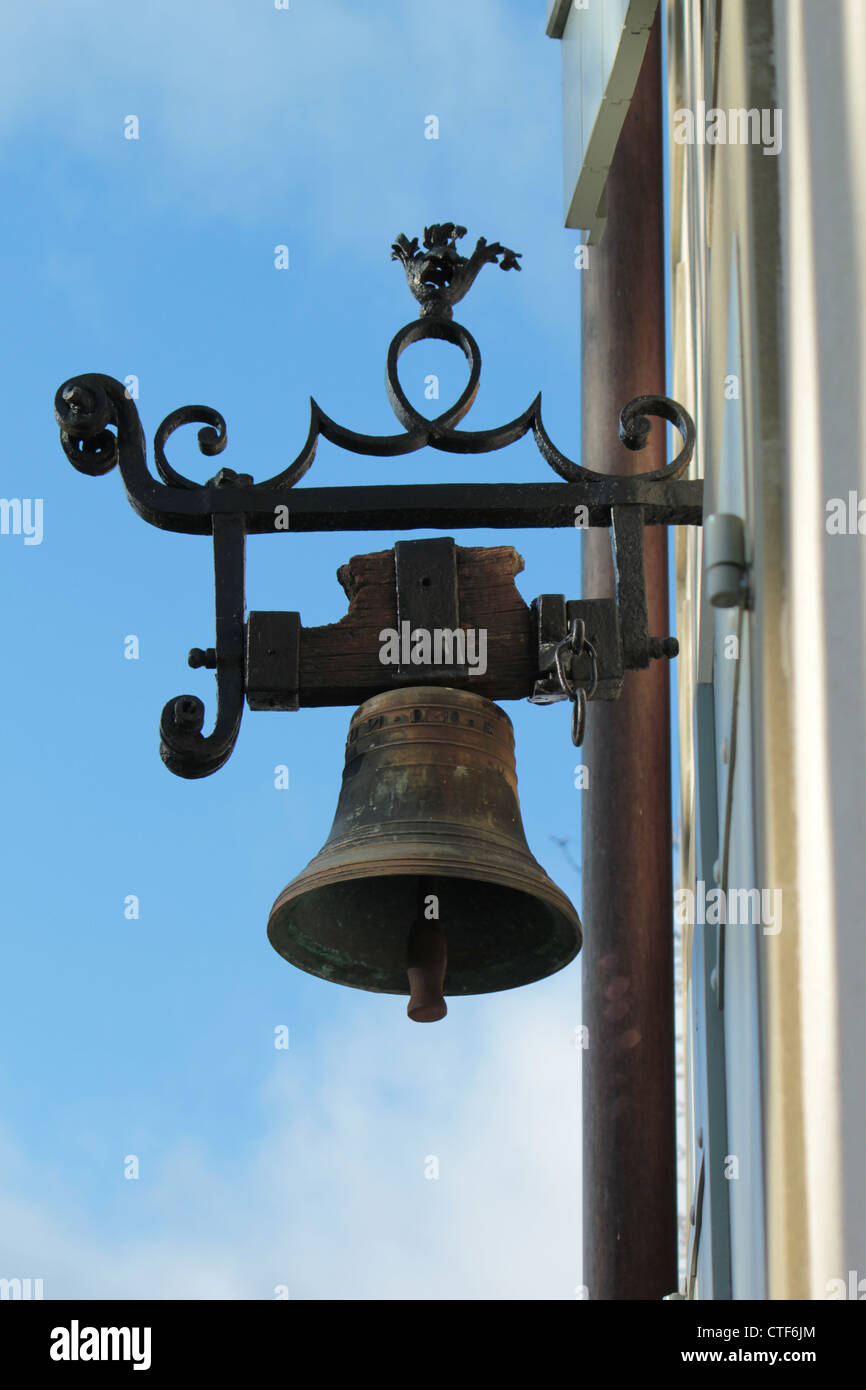 Old beautiful metallic bell on a wall Stock Photo - Alamy