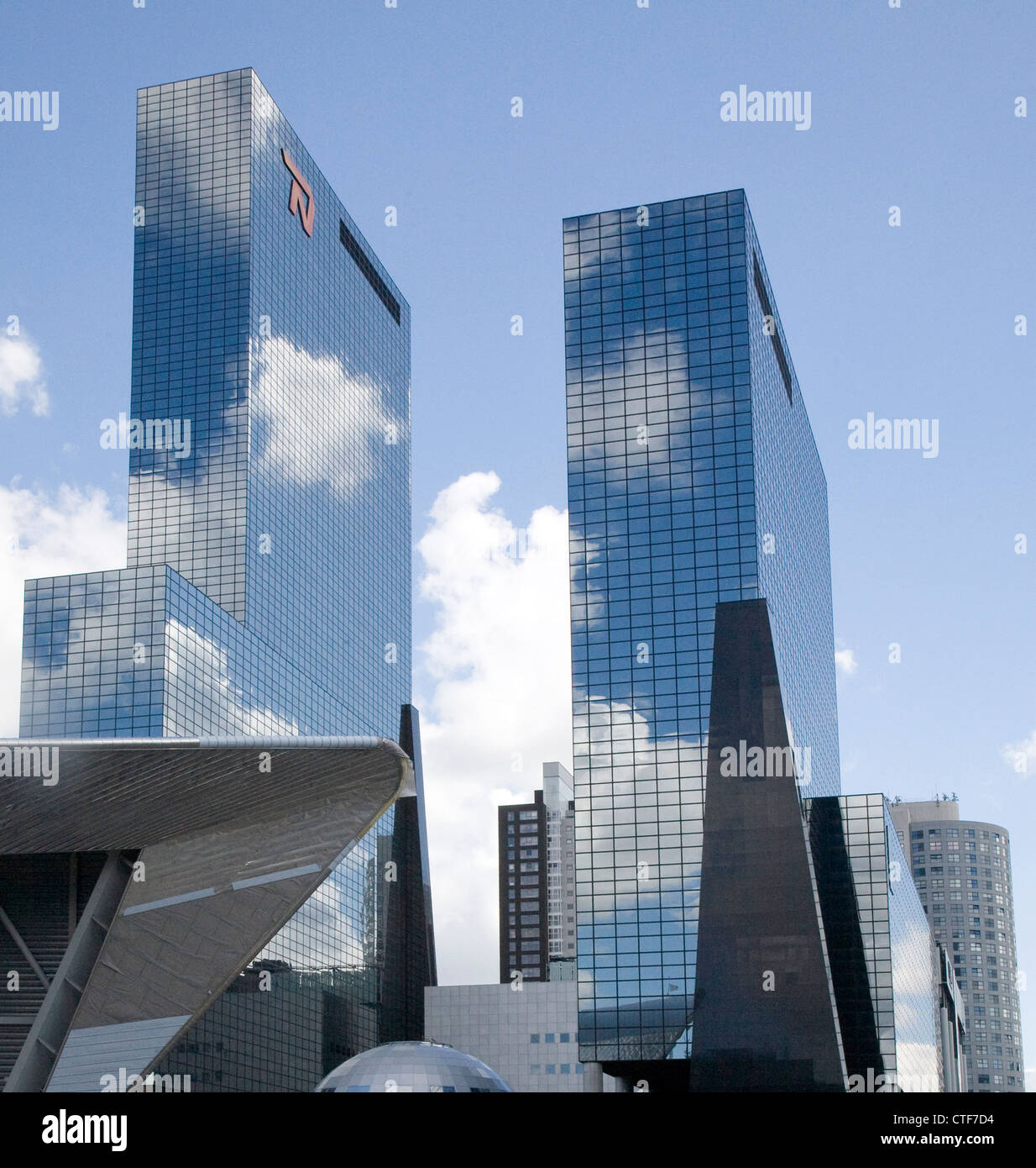 Clouds reflected by surface of Nationale Nederlanden office building in ...