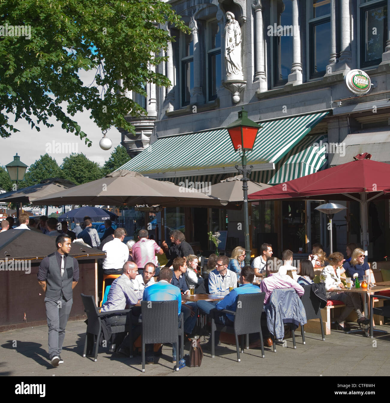 People sitting outside cafe bar Rotterdam Netherlands Stock Photo - Alamy