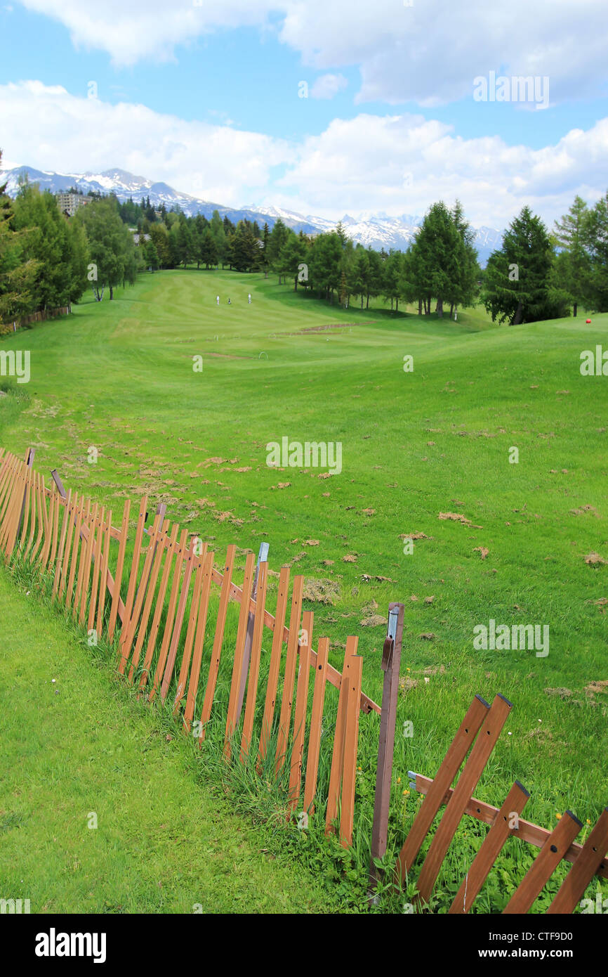 Golf course and fence by summer, Crans Montana, Switzerland Stock Photo ...