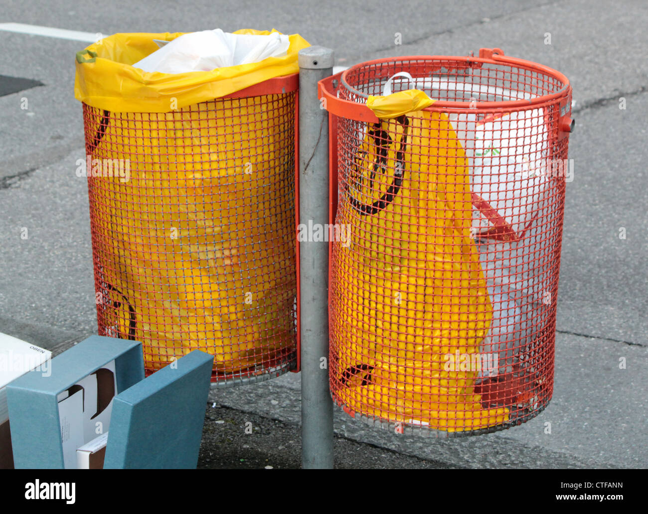 Two orange garbage bins with the streetl on the background Stock Photo ...