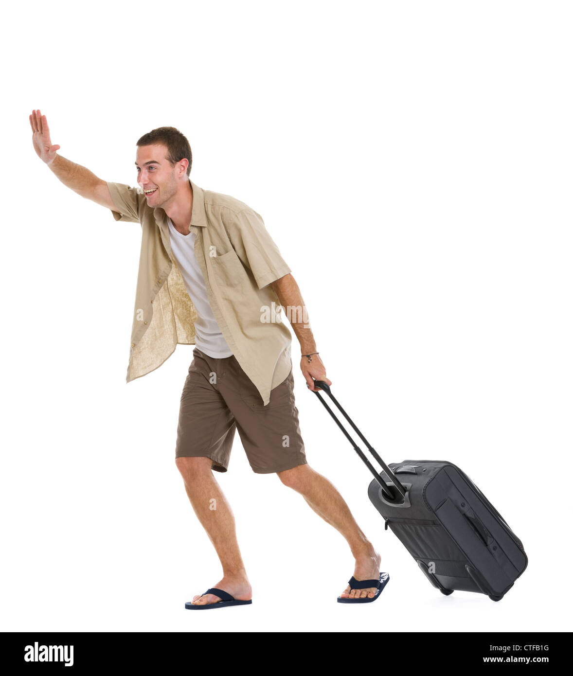Happy tourist with wheels bag hurry to airplane Stock Photo - Alamy