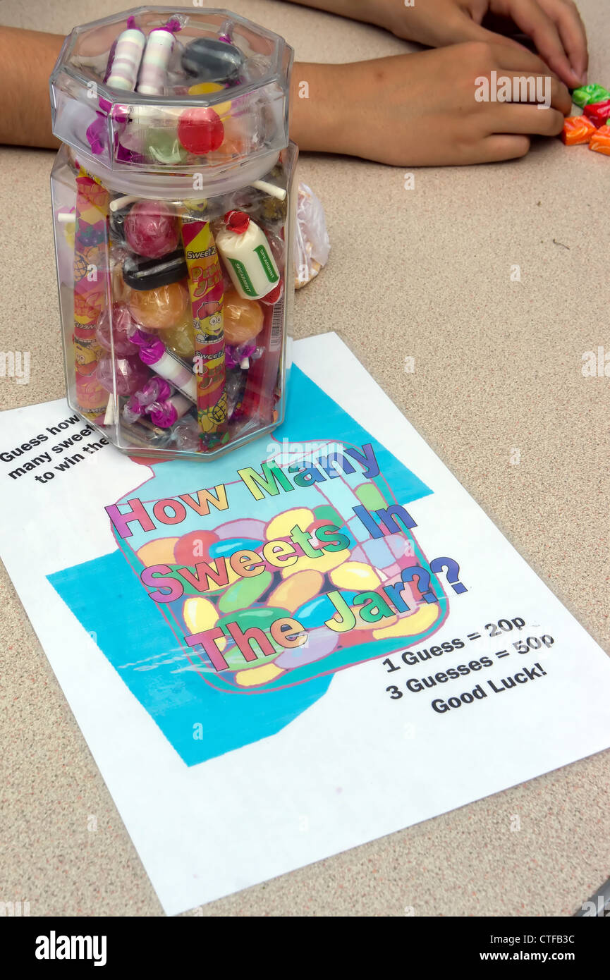Guess how many sweets in the jar, school fete game Stock Photo - Alamy