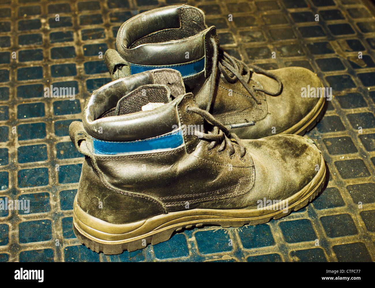 Dusty black leather work boots Stock Photo - Alamy