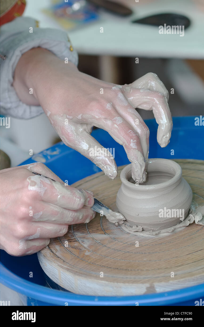 The potter engaged in manufacturing clay of products Stock Photo - Alamy
