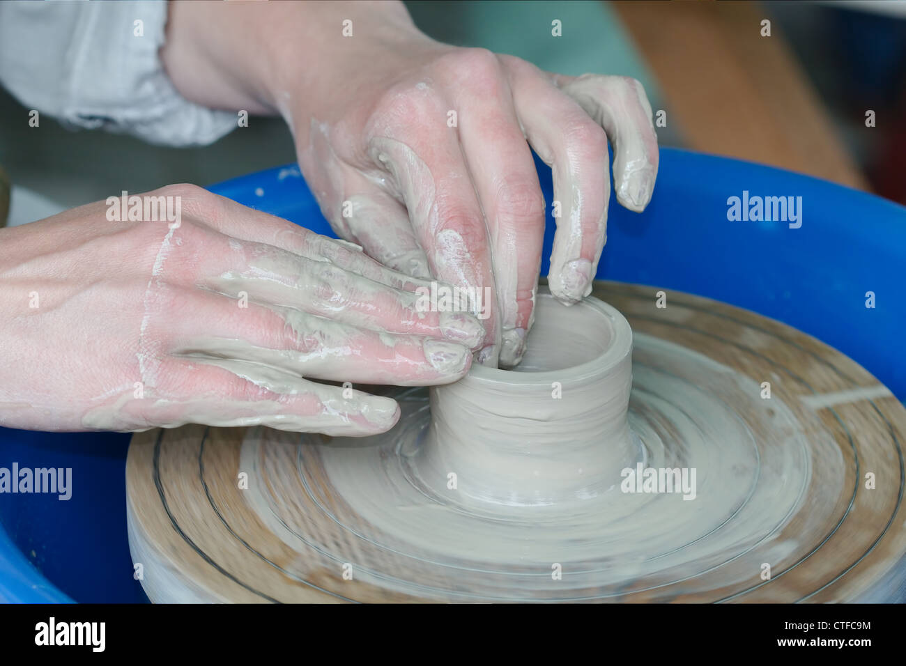 The potter engaged in manufacturing clay of products Stock Photo - Alamy