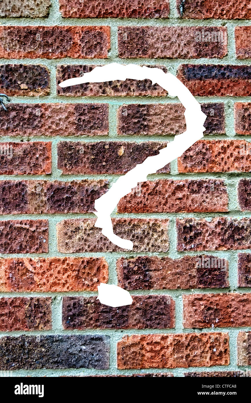 Brick wall with three question marks written on it Stock Photo - Alamy