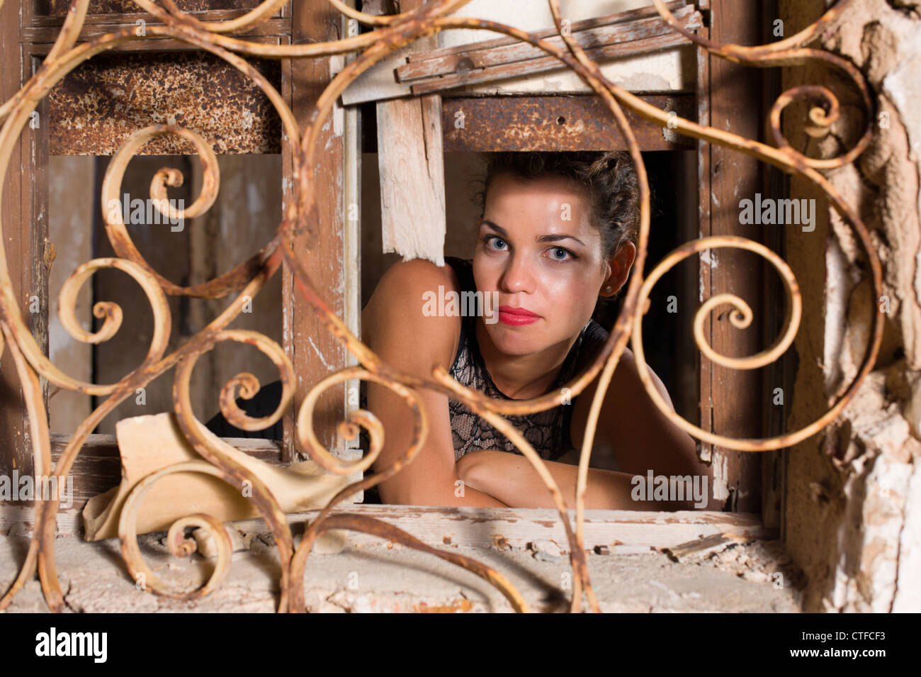 Woman behind window bars hi-res stock photography and images - Alamy