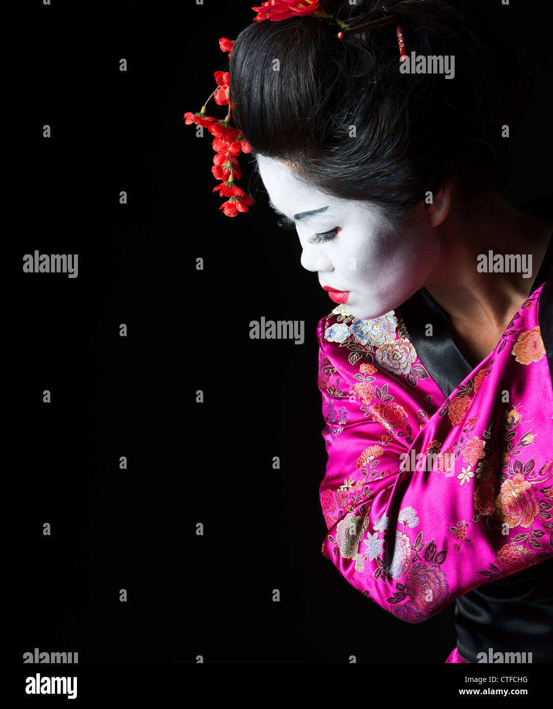 Closeup portrait of geisha isolated on black Stock Photo - Alamy