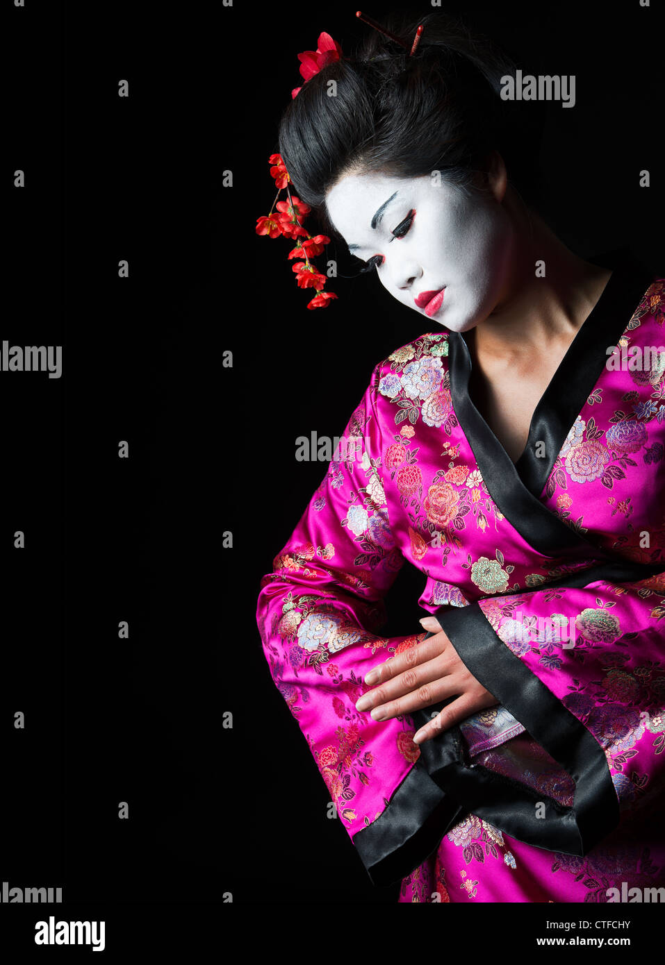 Closeup portrait of geisha isolated on black Stock Photo - Alamy