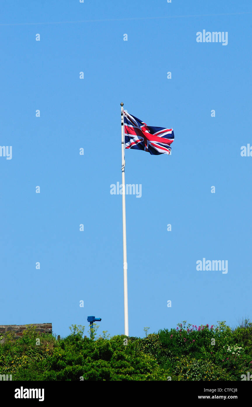 A flag pole with a union jack flag flying UK Stock Photo - Alamy