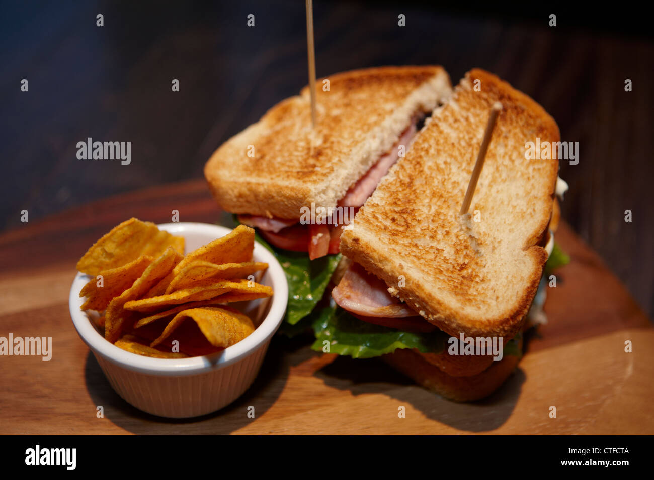 BLT toasted sandwich with nachos Stock Photo - Alamy