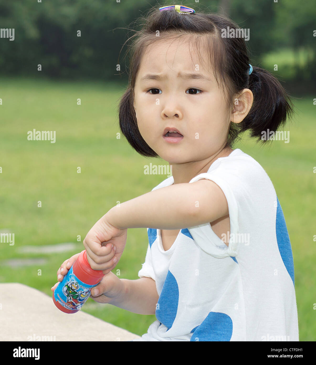 Little girl blowing bubbles, very beautiful Stock Photo - Alamy