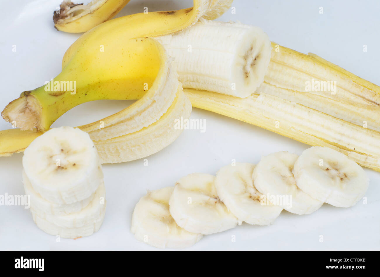 Sliced banana isolated on white Stock Photo - Alamy