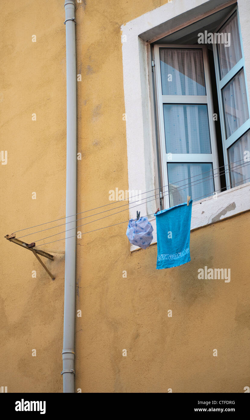 Window of old house with drying clothes Stock Photo - Alamy