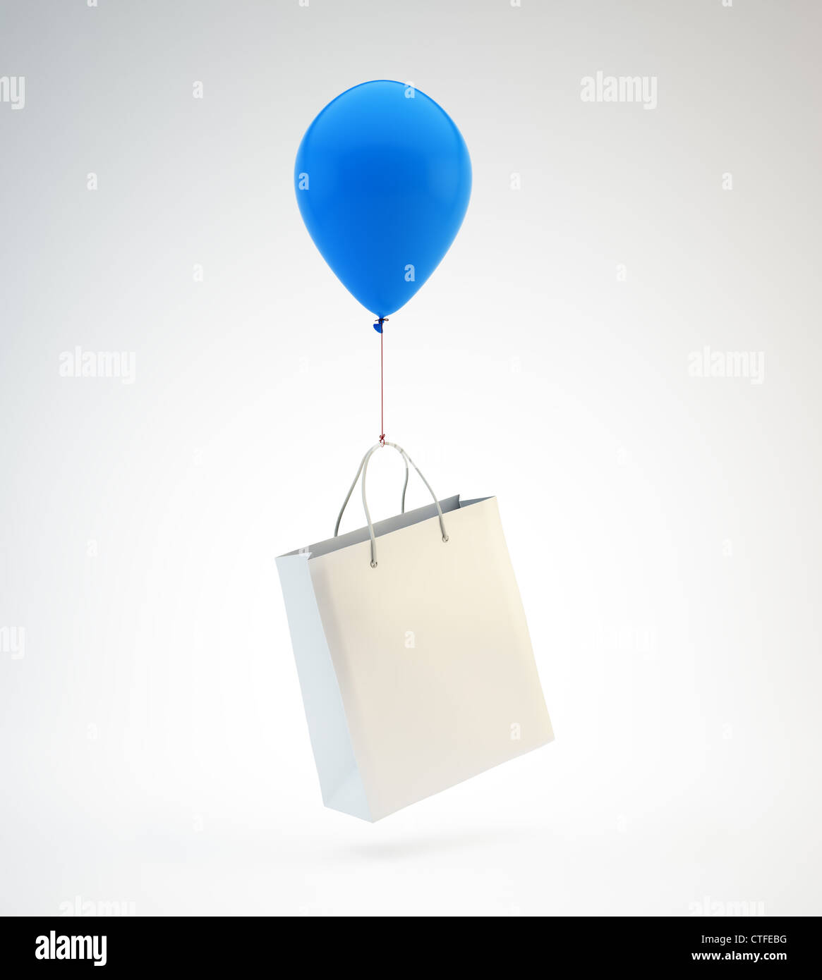 A blue balloon lifting a white shopping bag Stock Photo - Alamy
