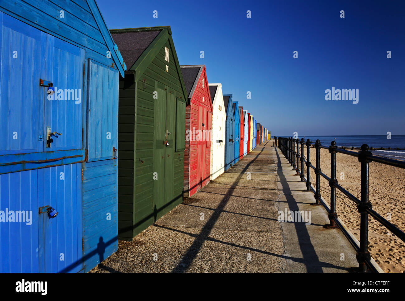 A view of the beach huts on the promenade at Mundesley-on-Sea, Norfolk ...