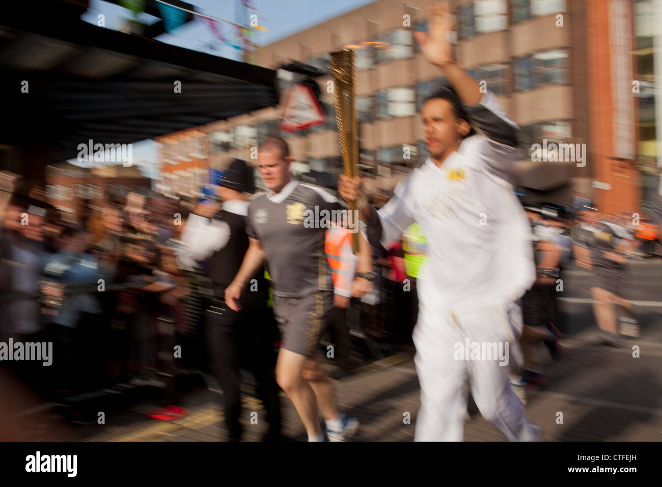 Torch bearer during olympic torch hi-res stock photography and images ...
