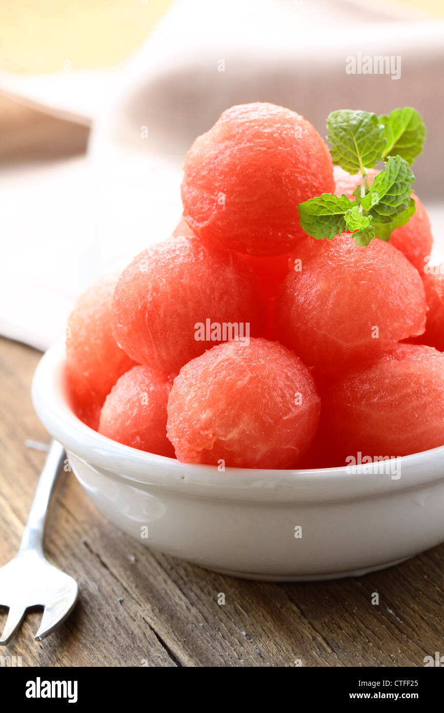 Fruit salad with watermelon balls and mint Stock Photo - Alamy