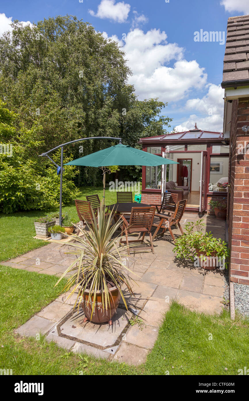 Middle class English suburban garden with patio and conservatory Stock ...