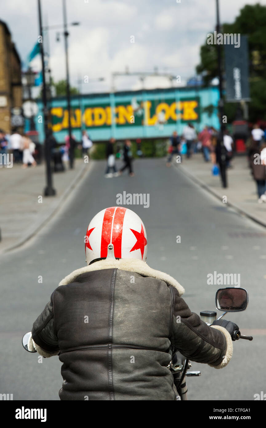 Biker on his motorcycle heading up Camden high street. London Stock ...