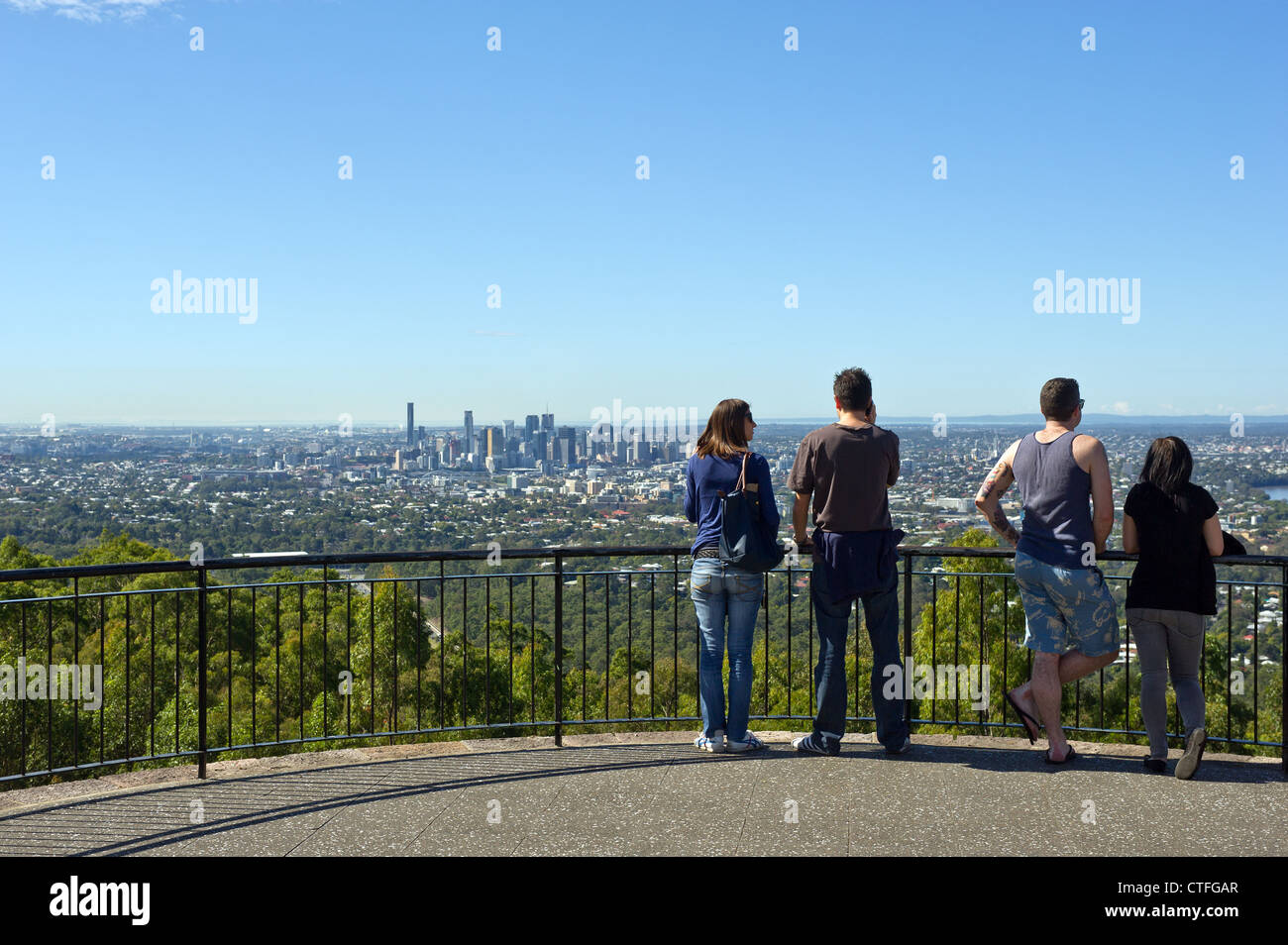 People looking out over the city of Brisbane from the summit of Mt ...