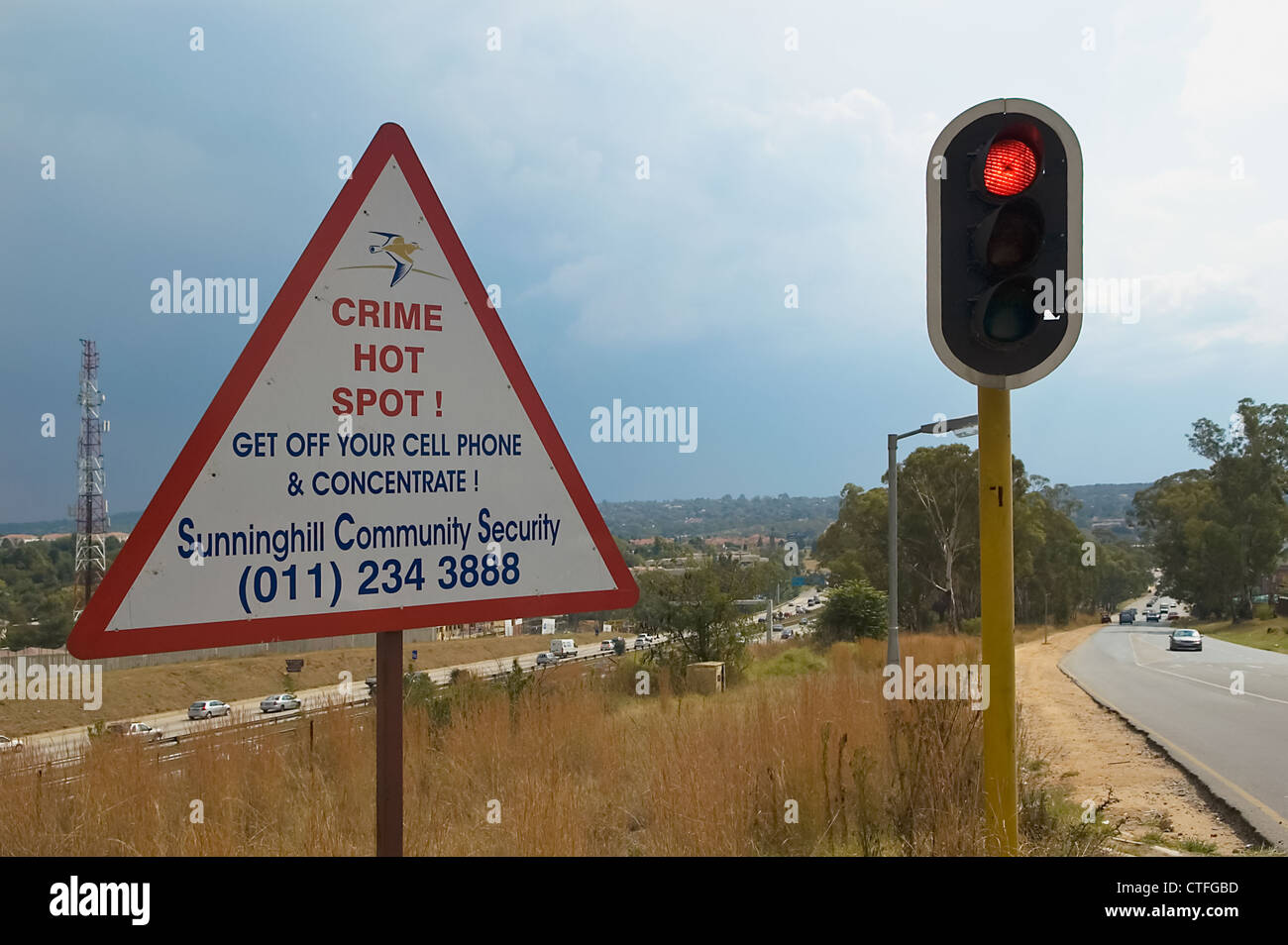 Sign warning of crime hot spot in Johannesburg Stock Photo - Alamy