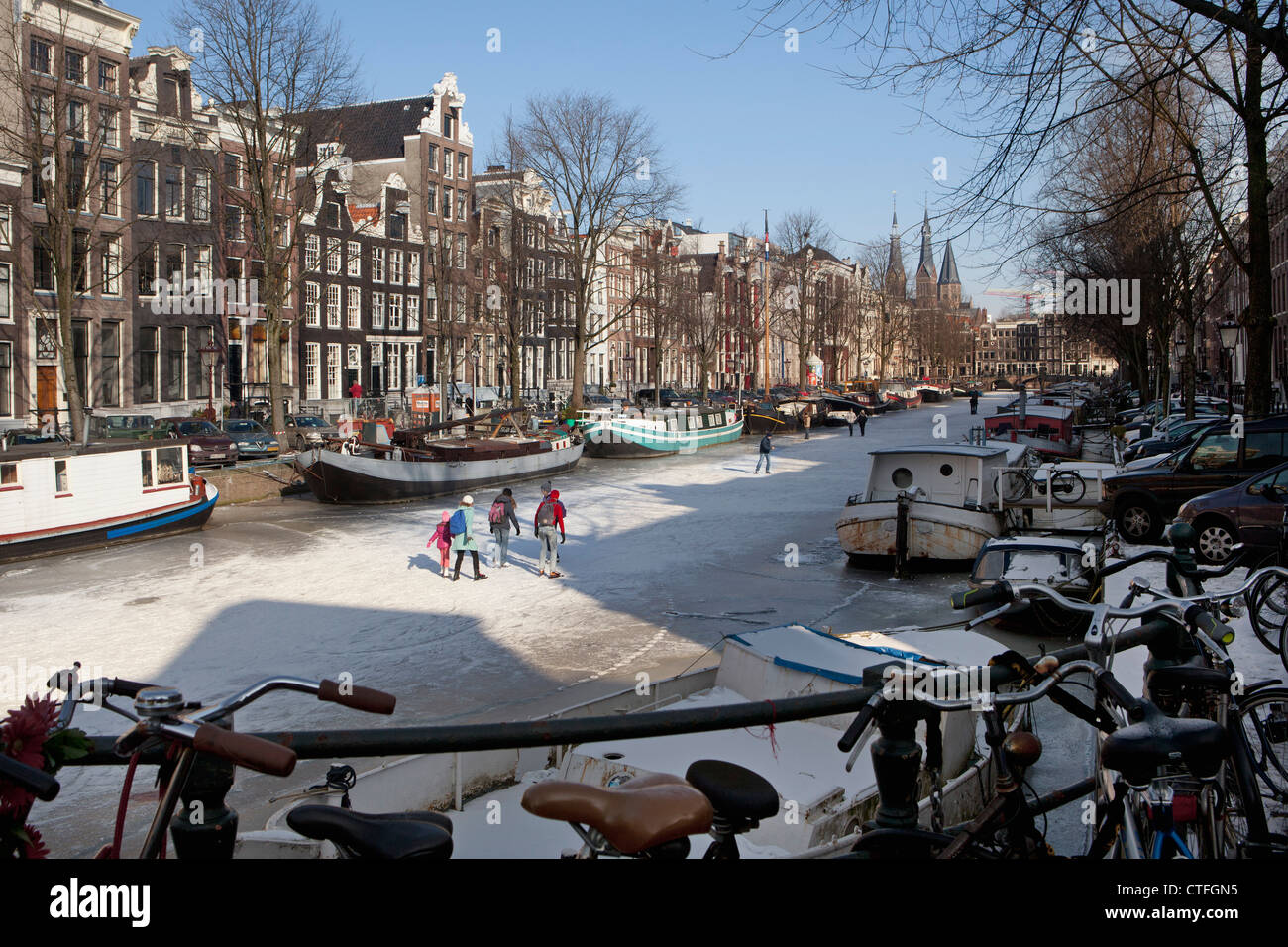 The Netherlands, Amsterdam, Winter, ice skating on frozen canals ...