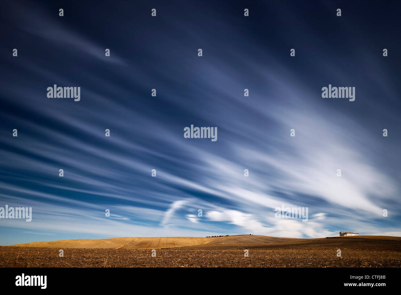 Unplanted farm field with moving clouds in southern Spain Stock Photo ...