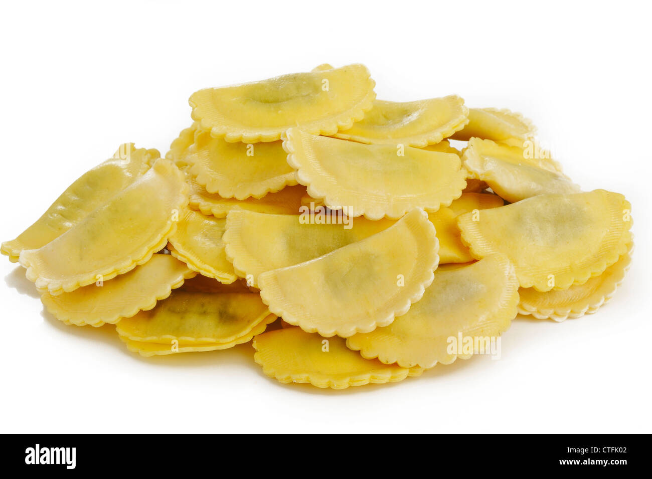 agnolotti pasta stuffed with spinach and ricotta cheese on white ...