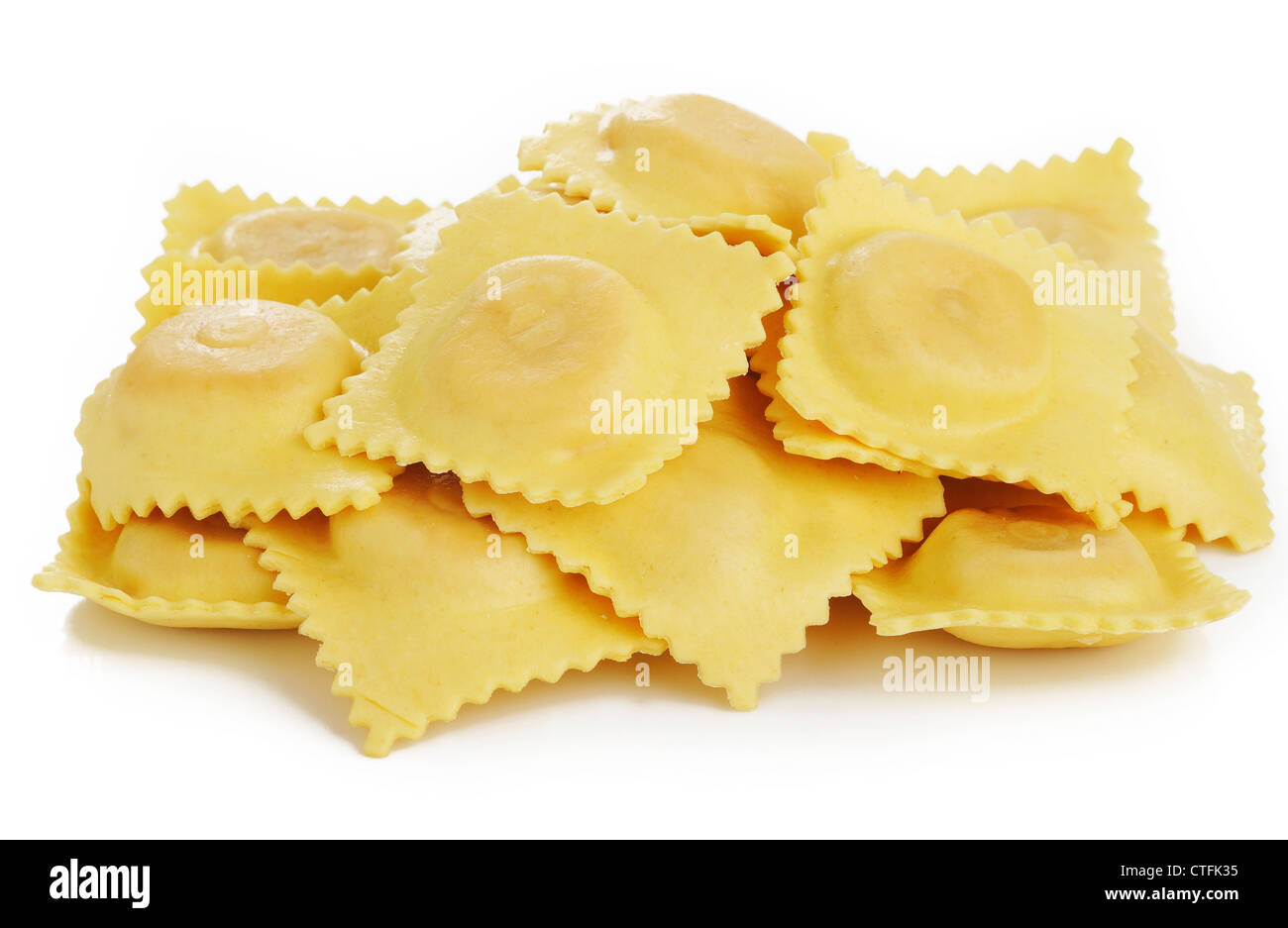 Dry ravioli pasta on white background Stock Photo - Alamy