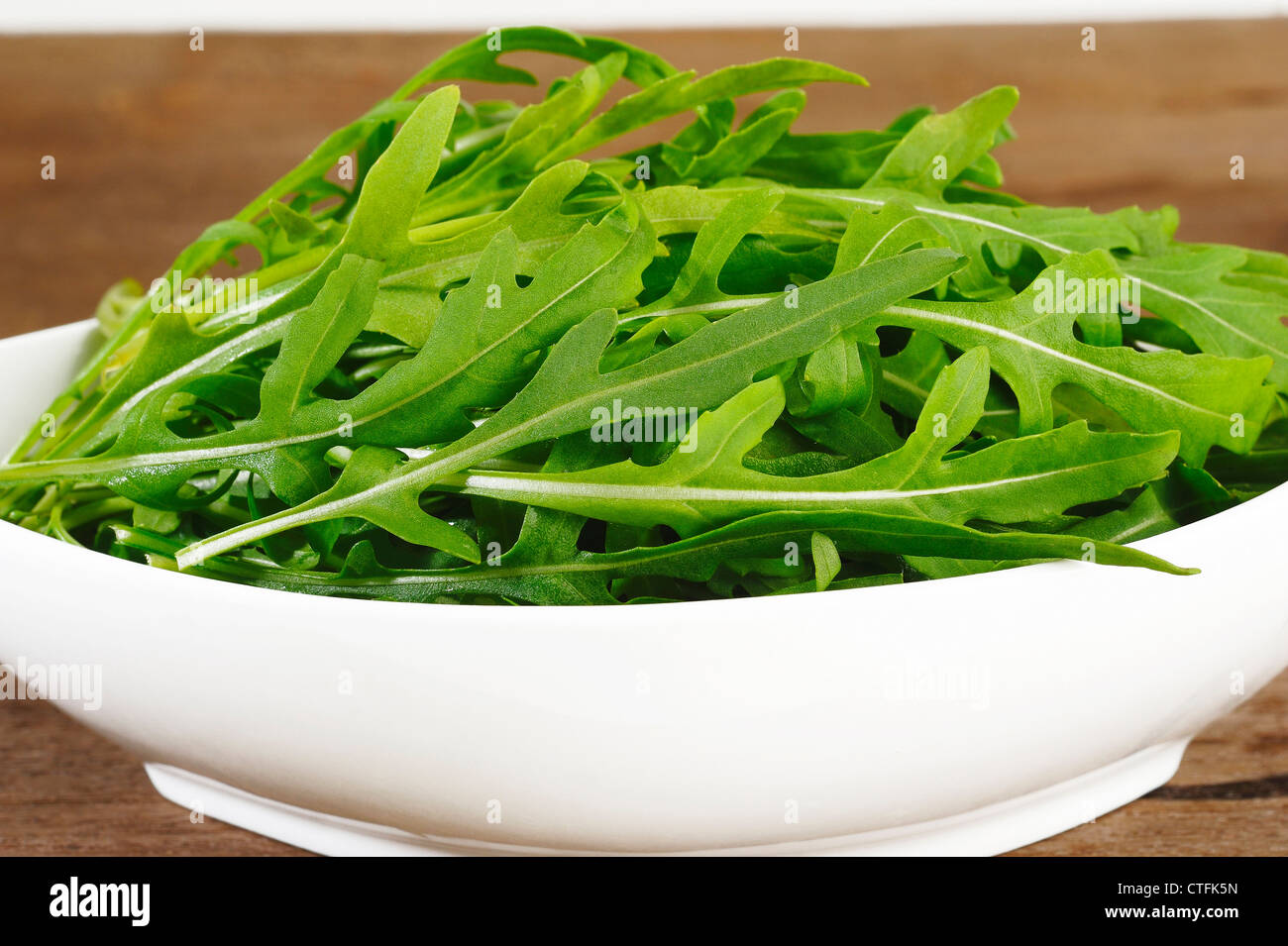 rucola fresh salad in white bowl Stock Photo - Alamy