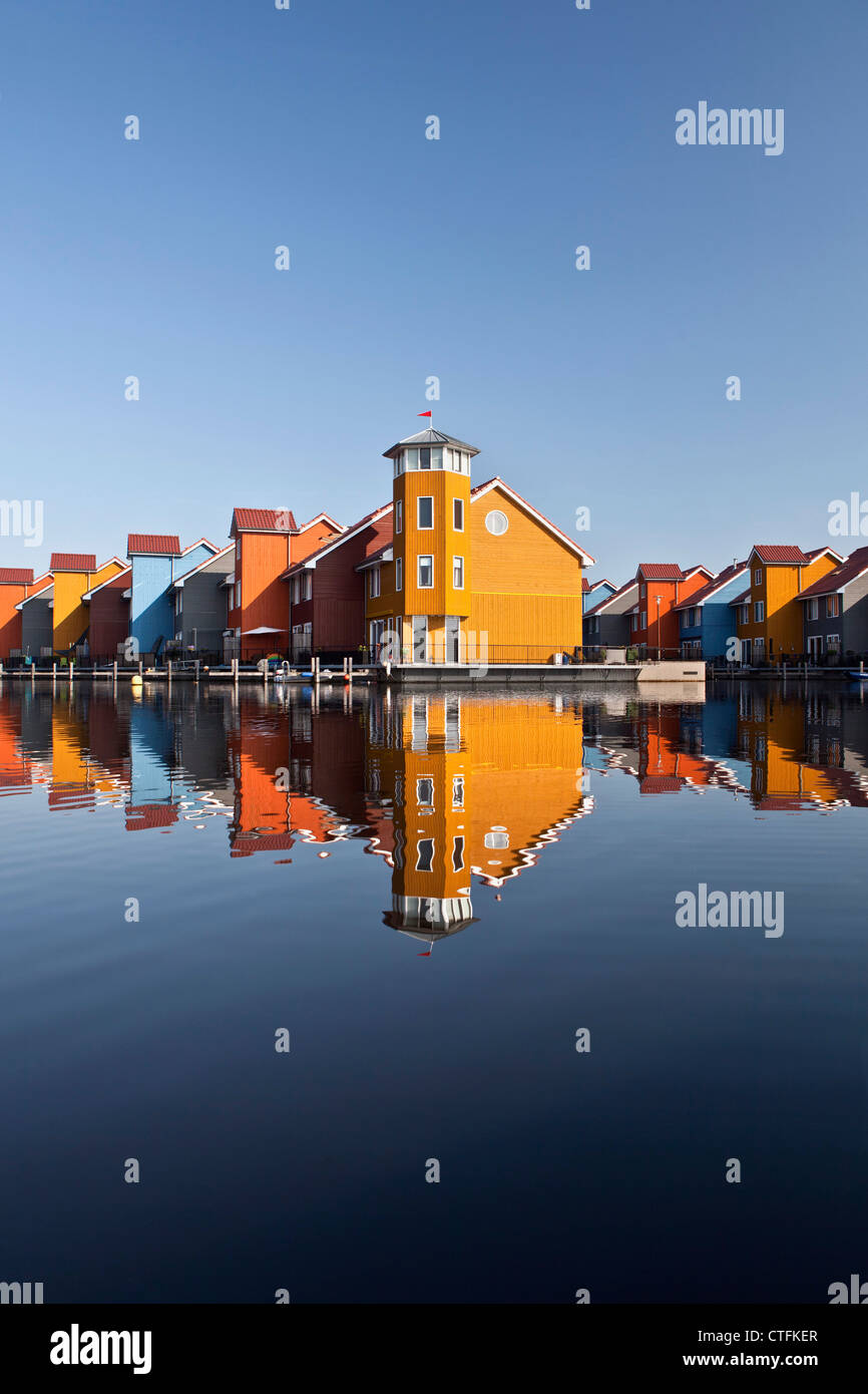 The Netherlands, Groningen, Colorful residential houses and marina ...