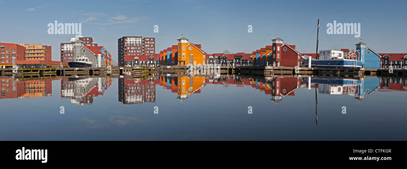 The Netherlands, Groningen, Colorful residential houses and marina ...