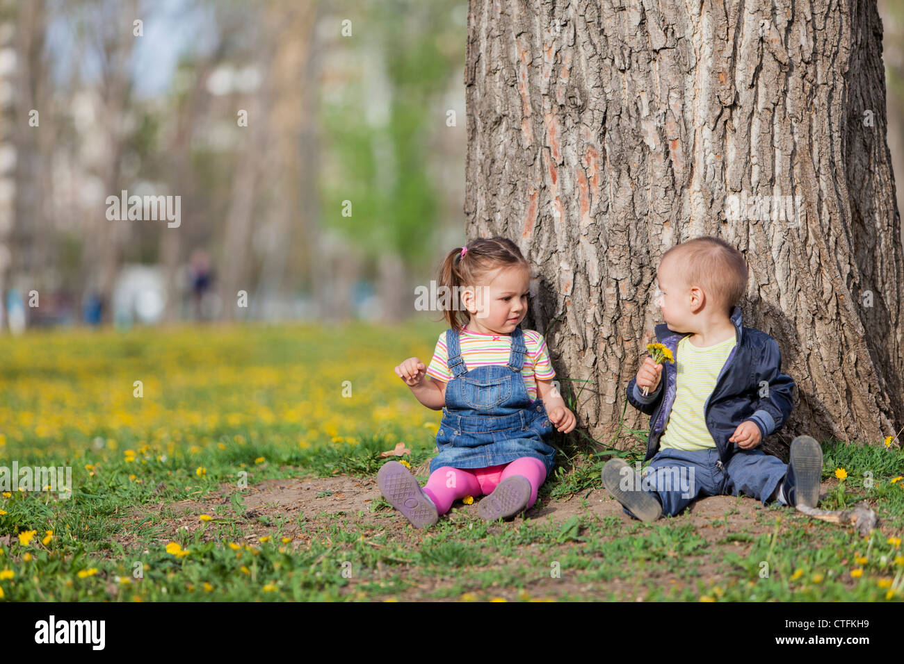 Kids in the field Stock Photo - Alamy