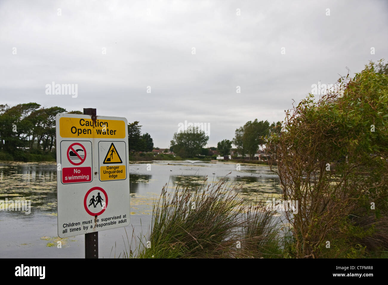 Caution Open Water warning side Stock Photo - Alamy
