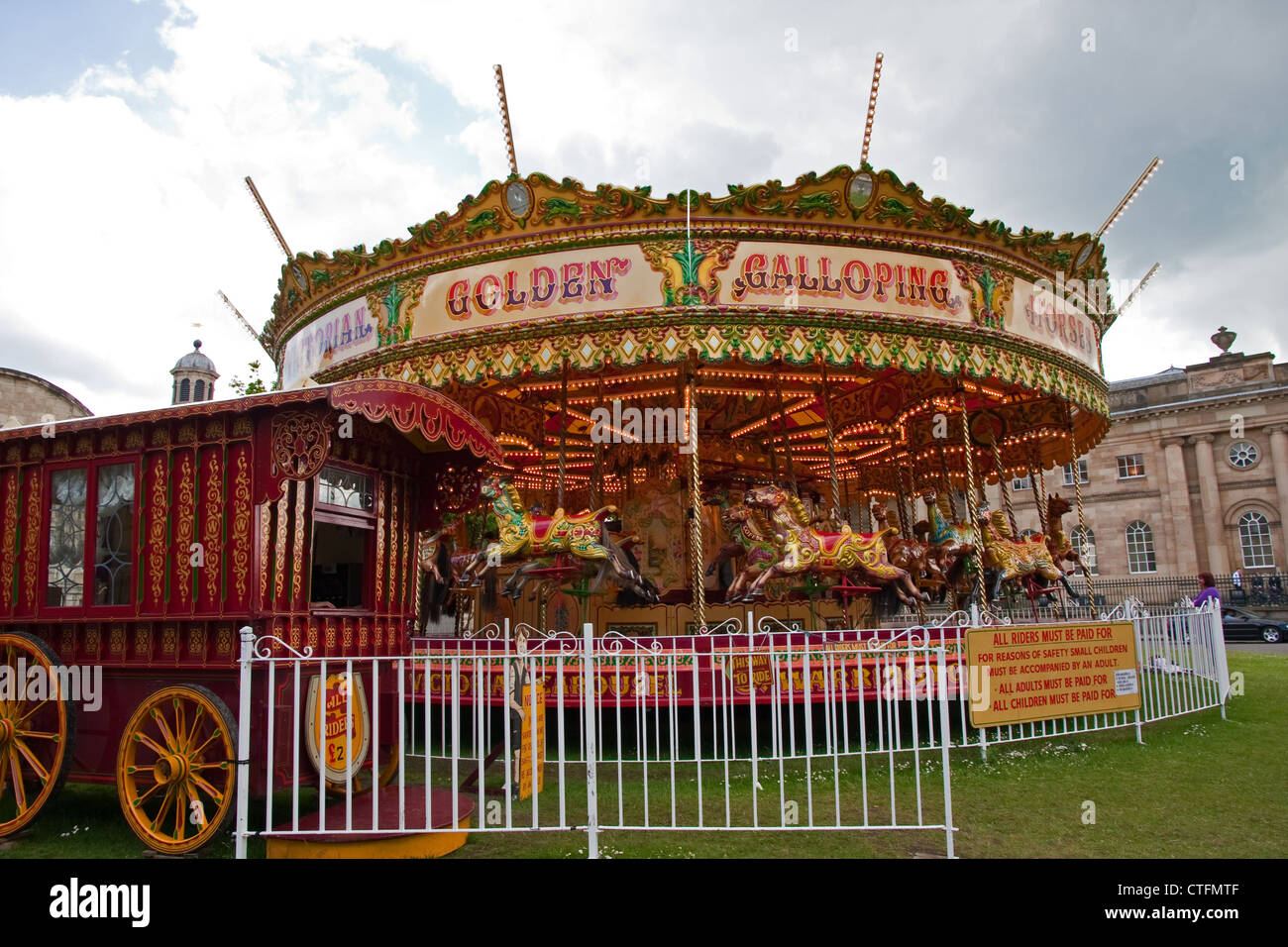 Roundabout with galloping horses hi-res stock photography and images ...