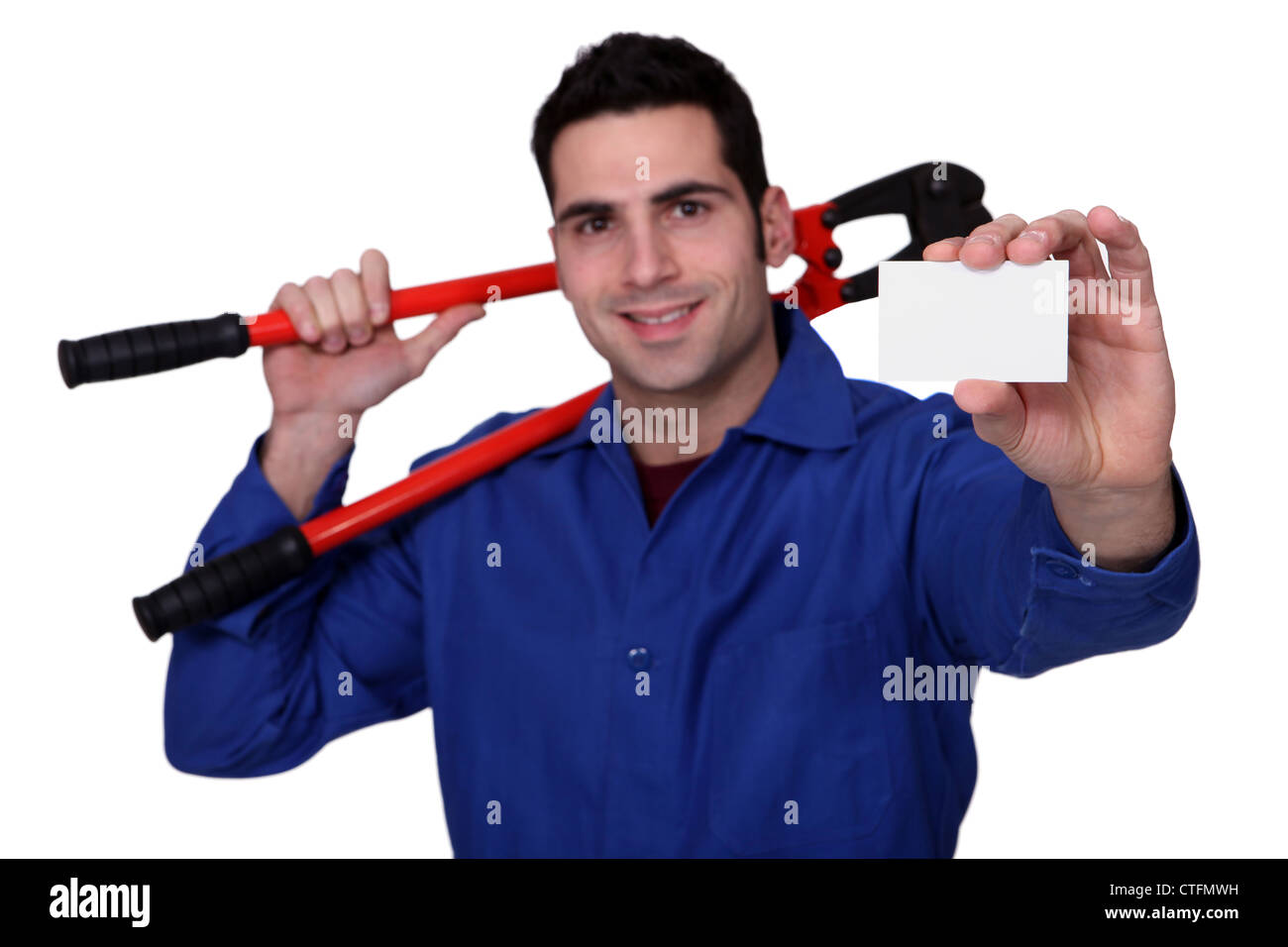 worker with giant spanner holding business card Stock Photo - Alamy