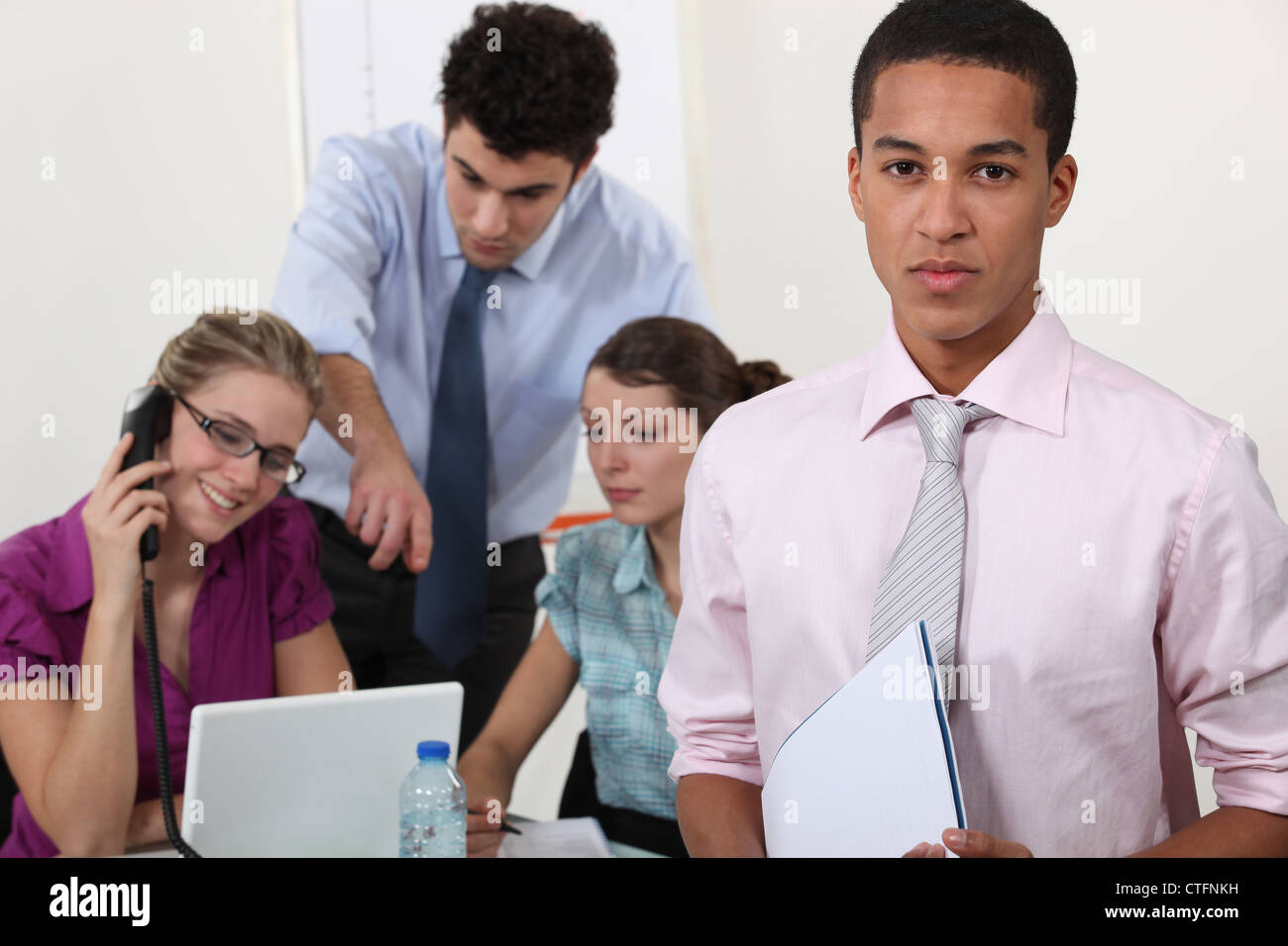 Four office colleagues Stock Photo - Alamy