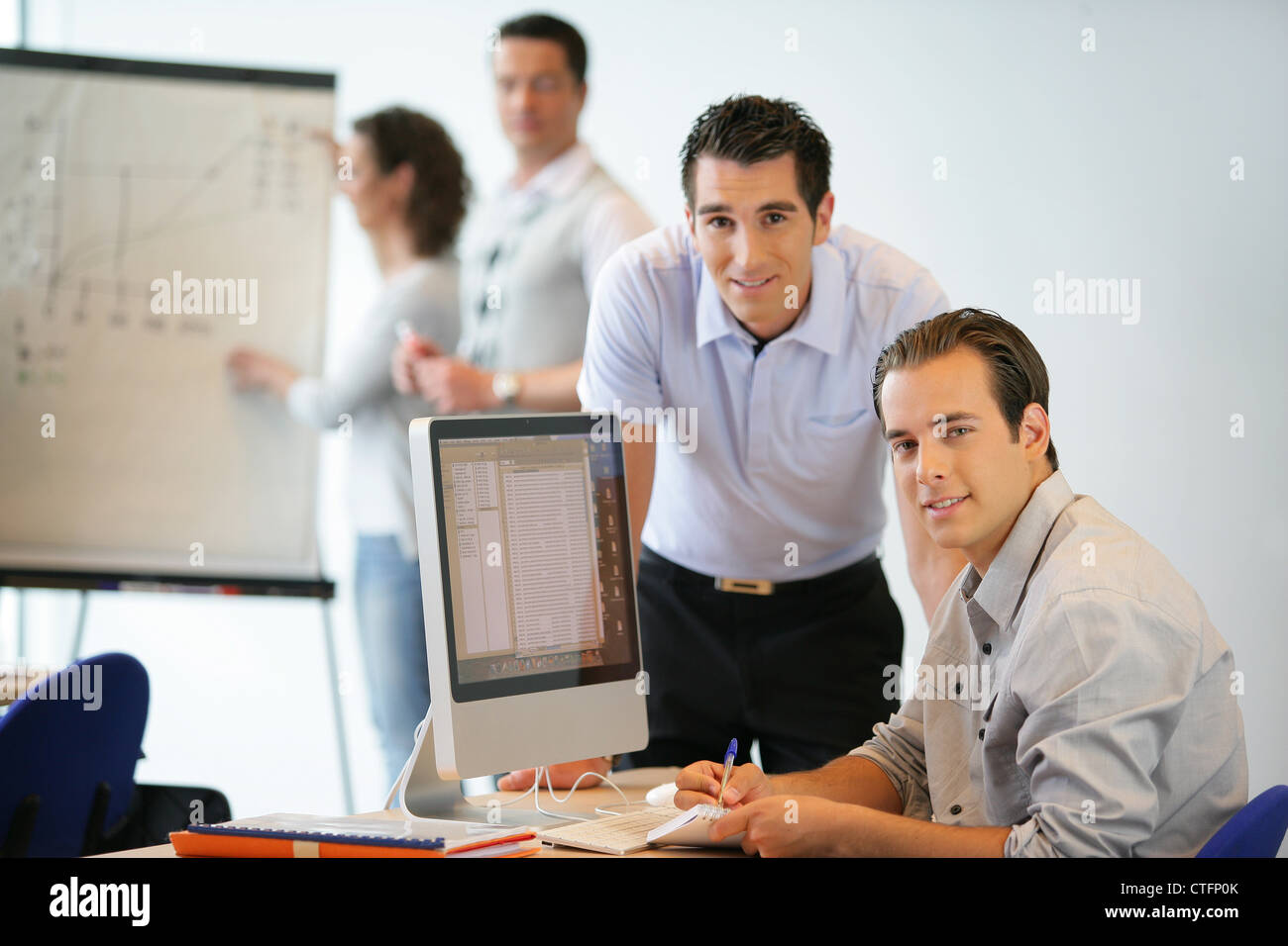 Busy businessteam planning Stock Photo - Alamy