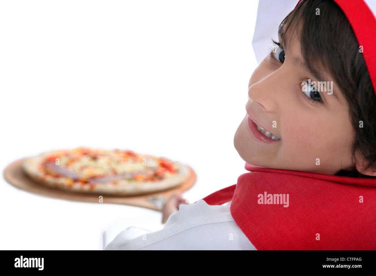 Young boy making pizza Stock Photo - Alamy