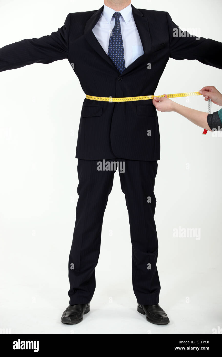 Taking measure for a new suit Stock Photo - Alamy