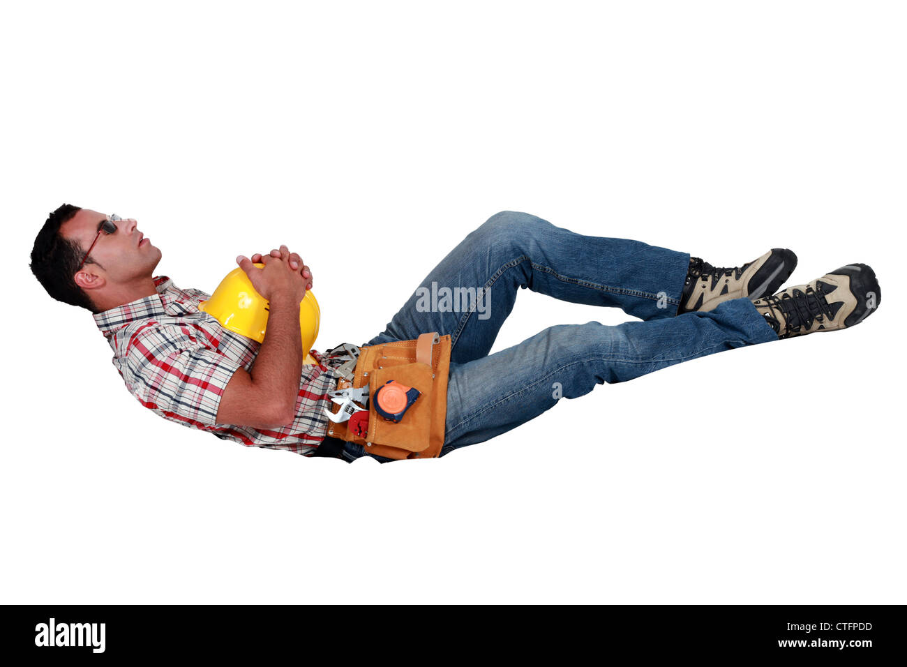 Builder relaxing for a change Stock Photo - Alamy