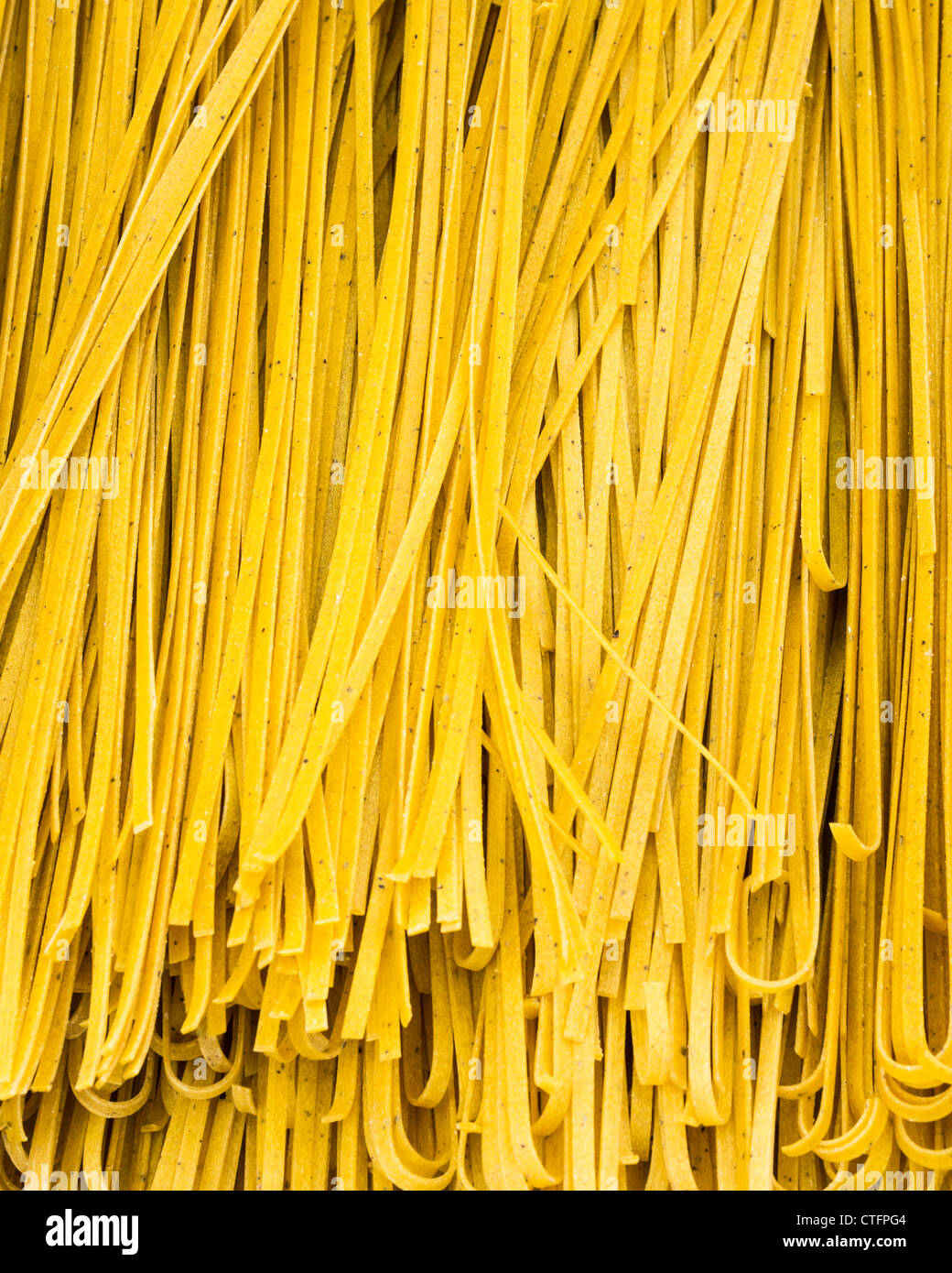 Freshly made flavored pasta drying and ready for use Stock Photo - Alamy