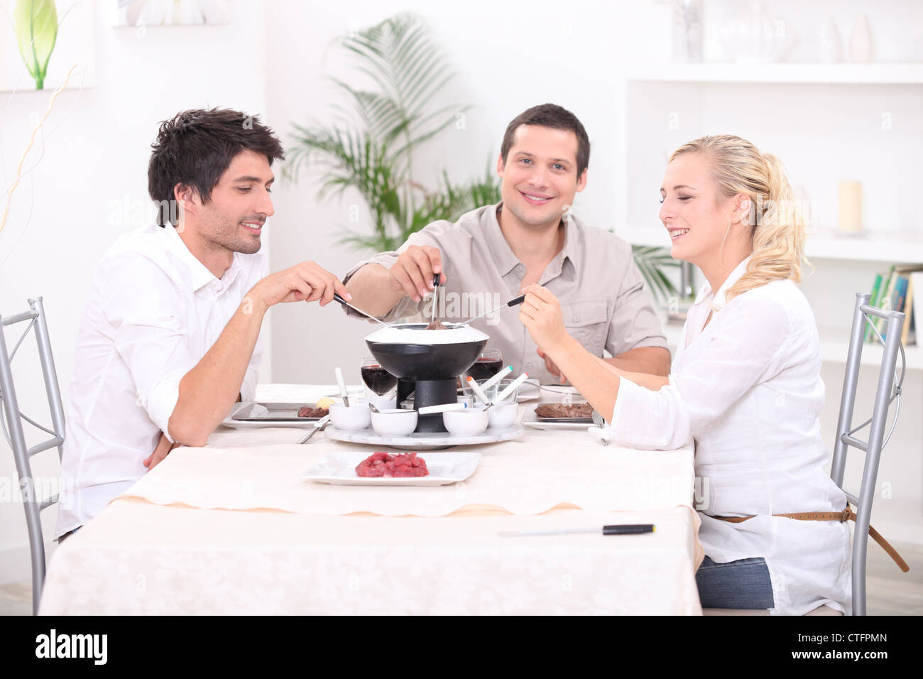 Cheese fondue woman hi-res stock photography and images - Alamy