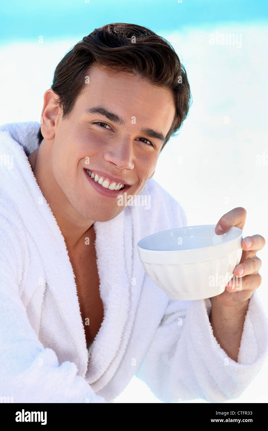 Man smiling with a bowl Stock Photo - Alamy
