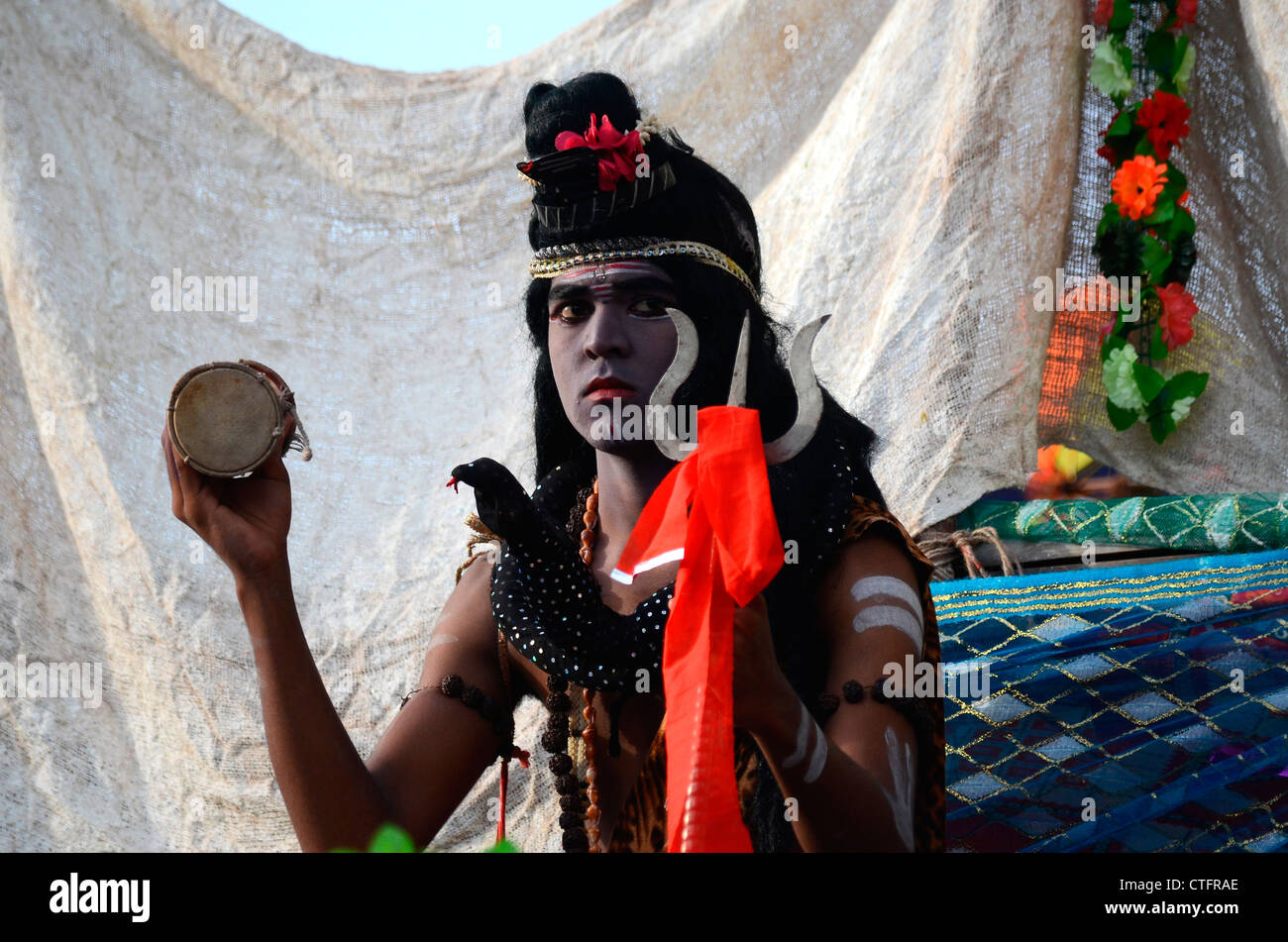 A man posing as Lord Shiva in a float Stock Photo - Alamy
