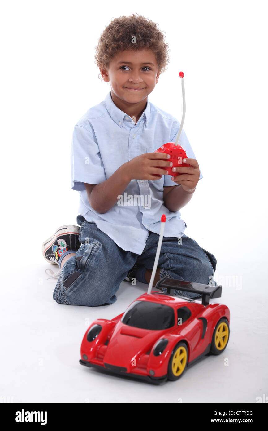 Boy playing with car Stock Photo - Alamy
